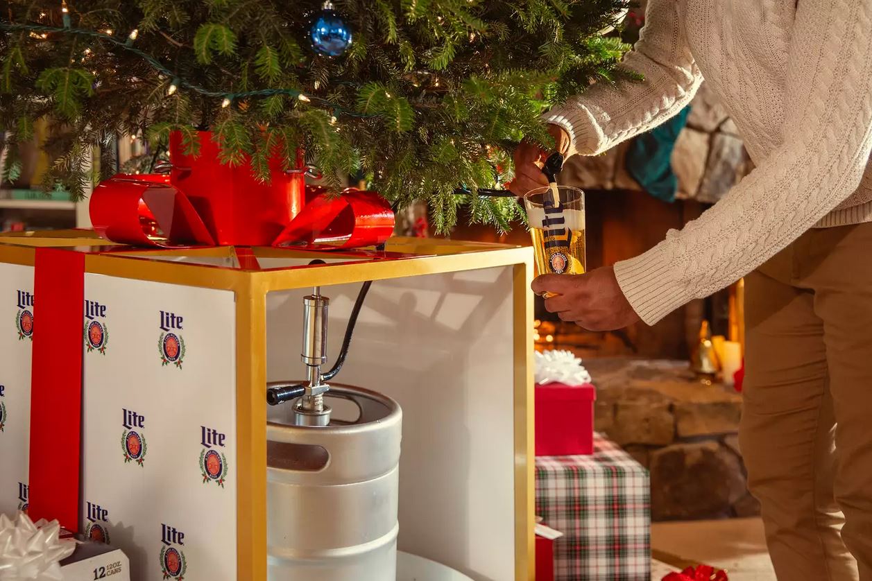 MILLER LITE HAS YOUR NEW TREE STAND AND IT SERVES A DUAL PURPOSE - KQ98